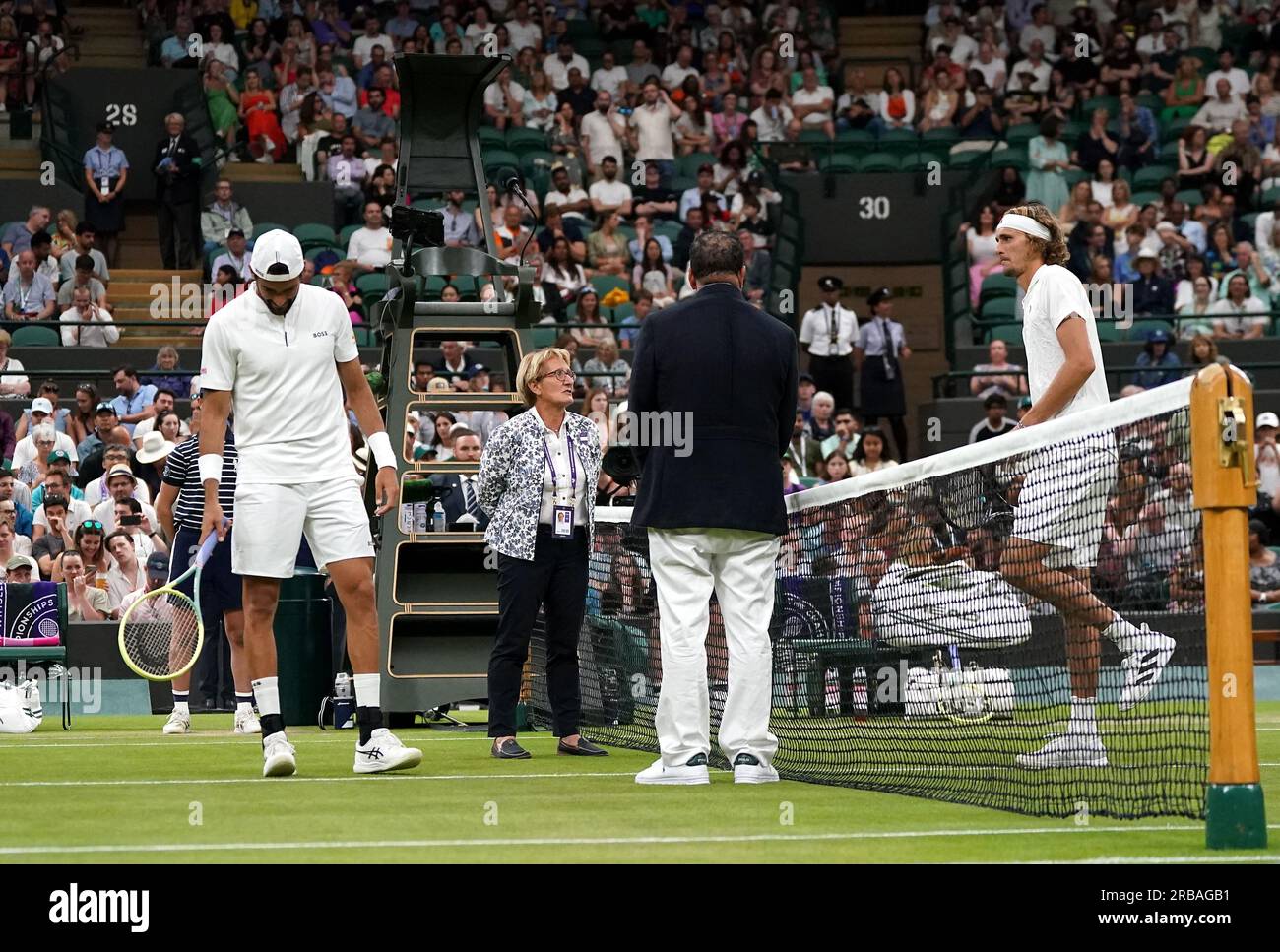 Matteo Berrettini and Alexander Zverev speak to the officials on court ...