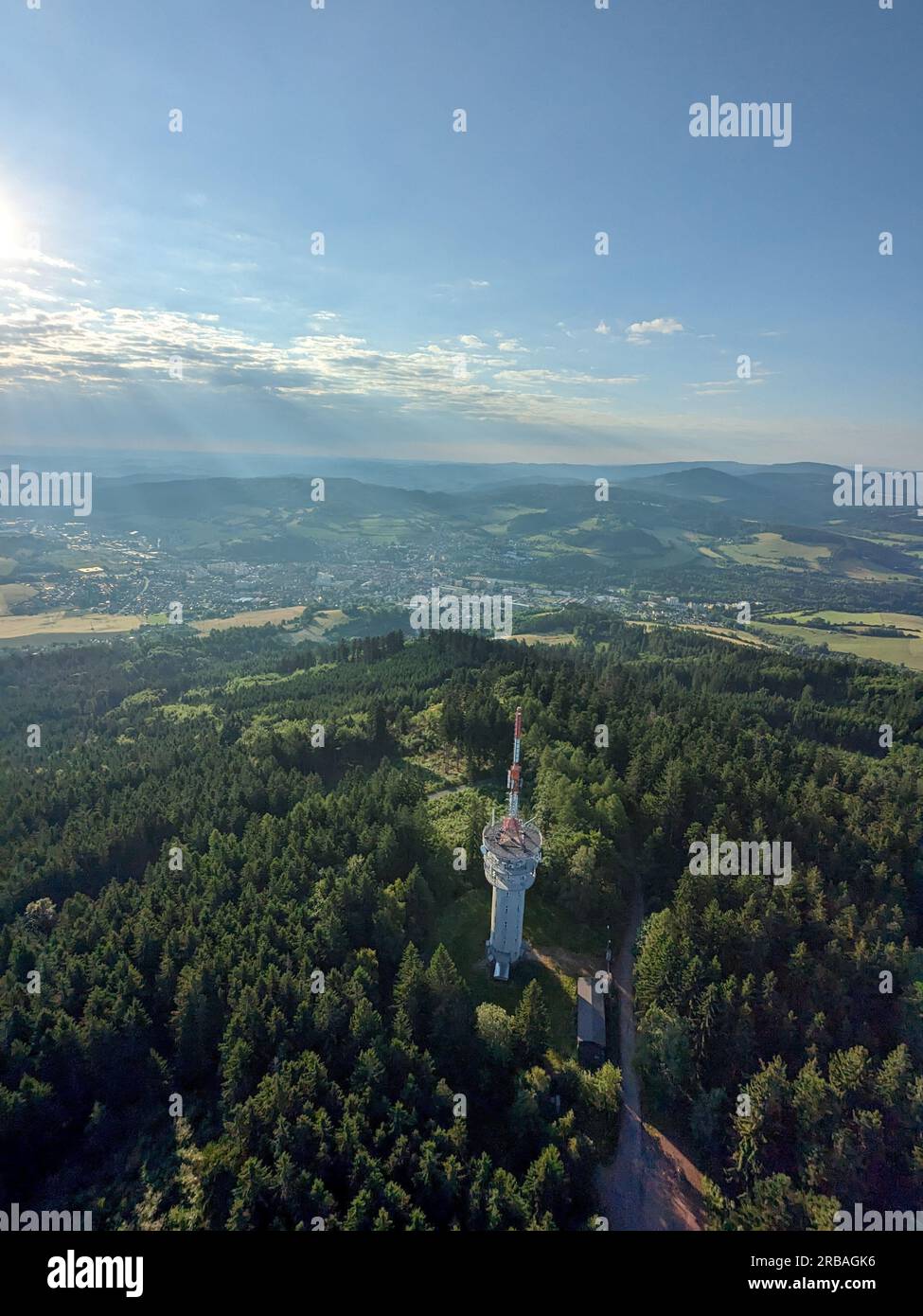 Aerial view of the top of Svatobor hill with a historic lookout tower ...