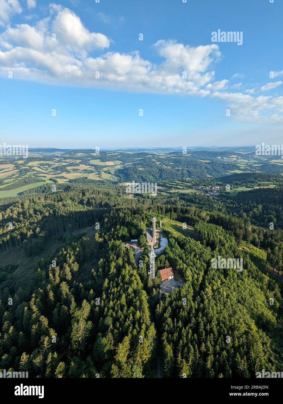 Aerial view of the top of Svatobor hill with a historic lookout tower ...