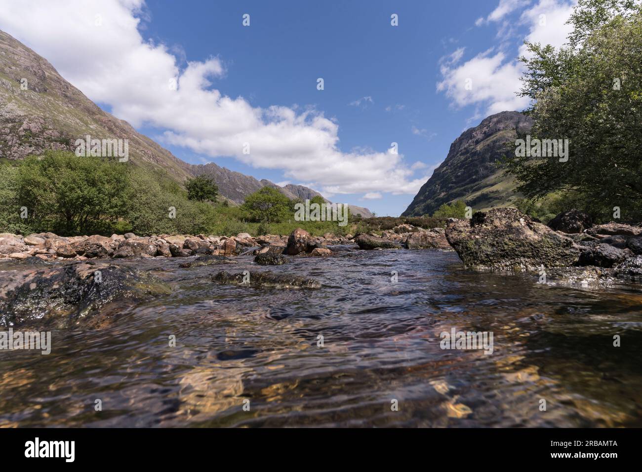 River Coe with mountains in background Stock Photo - Alamy