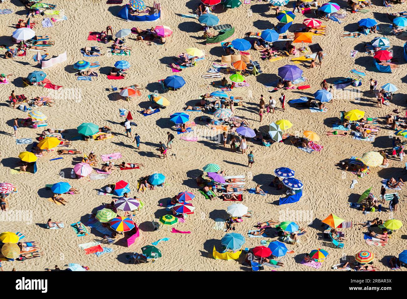 View from above of anonymous crowd, holidaymakers, colourful parasols ...