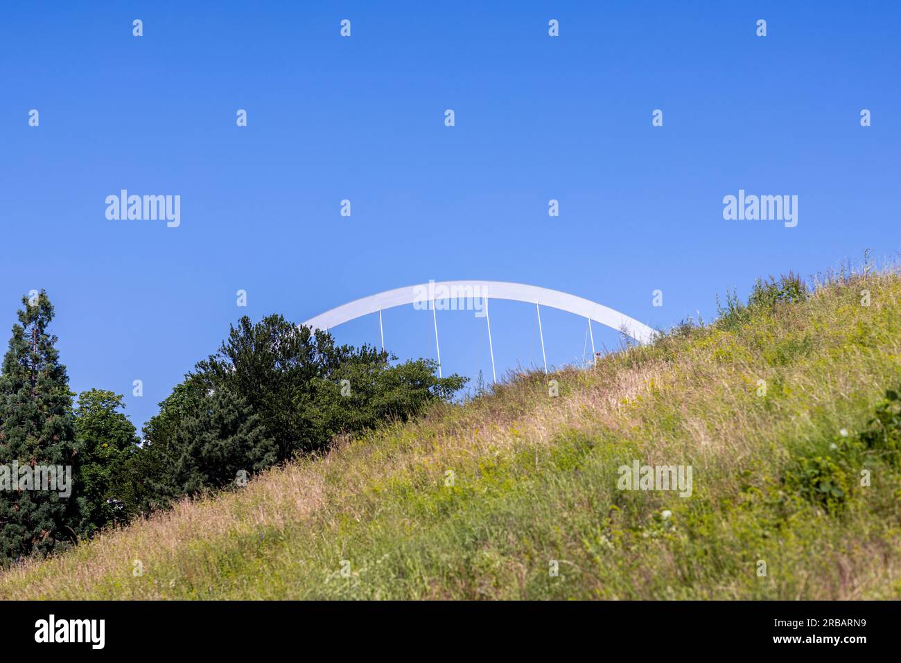 Lanxess Arena Arch visible from distance on a summer day Stock Photo ...