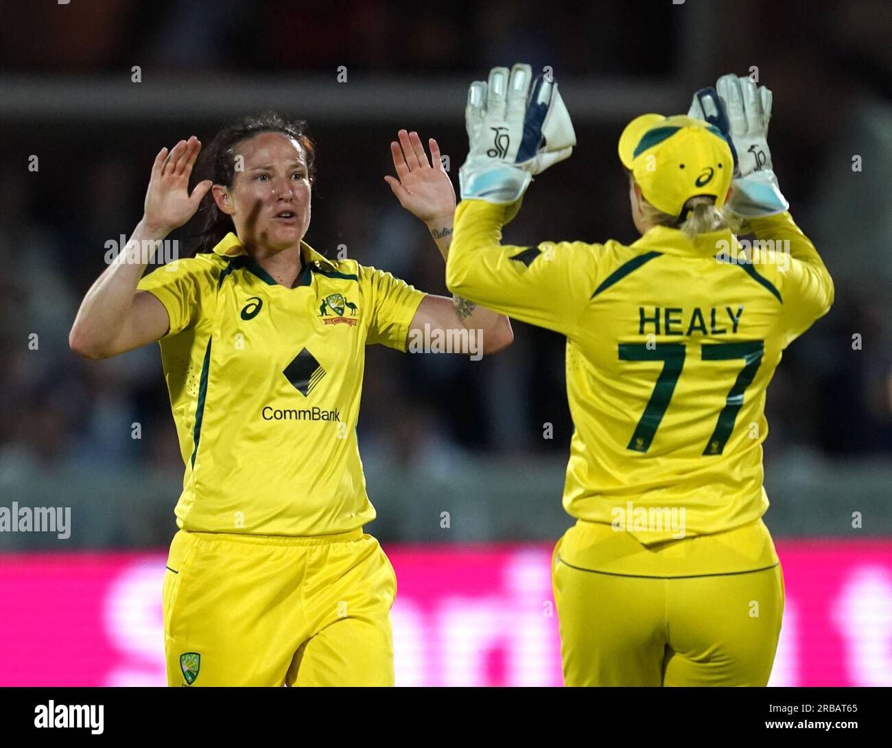Australia's Megan Schutt and Alyssa Healy celebrate the wicket of ...