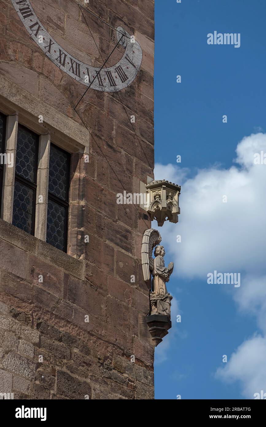 Nassau House, historic residential tower with sundial and angel ...
