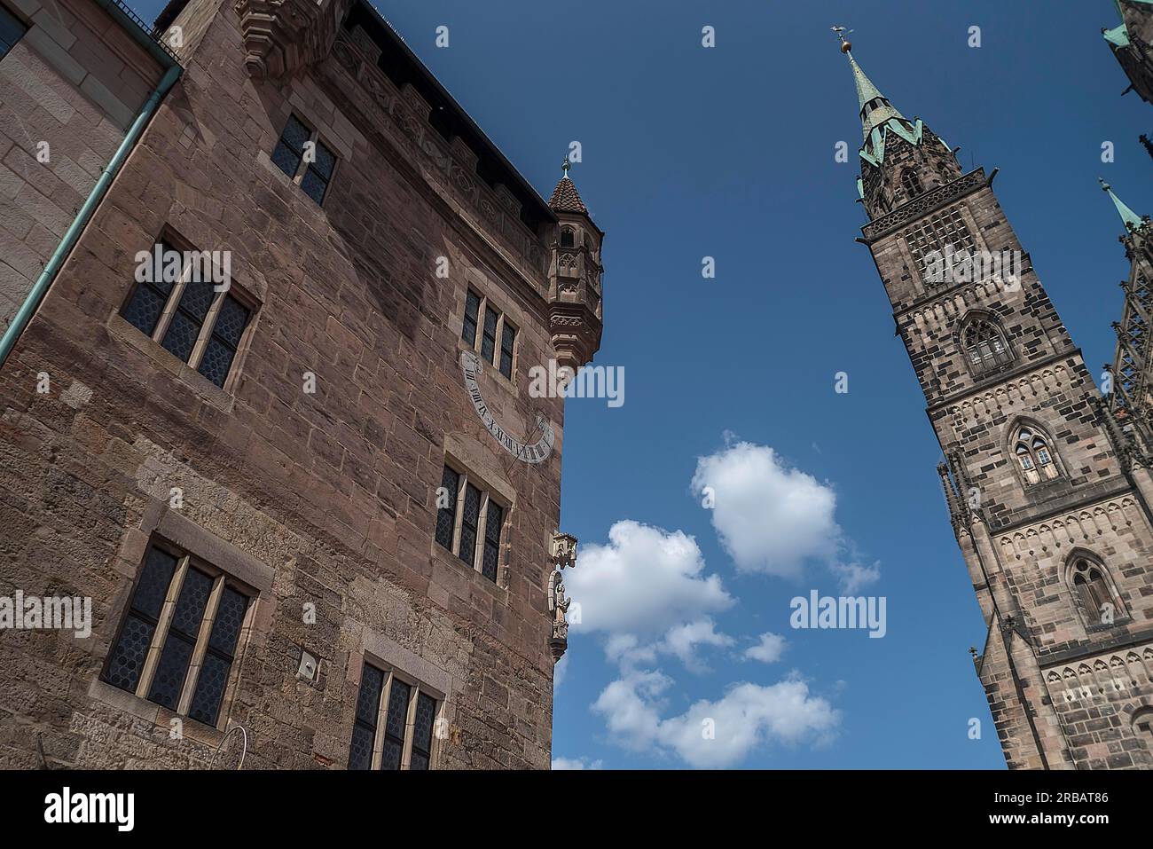 Historic residential tower with sundial and angel sculpture, tower of ...