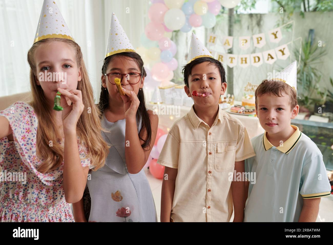 Blowing party horns hi-res stock photography and images - Alamy