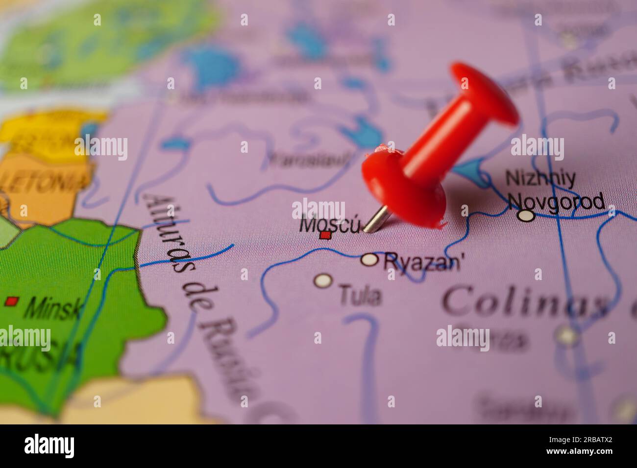Moscow marked with a red thumbtack on a map with an out-of-focus ...