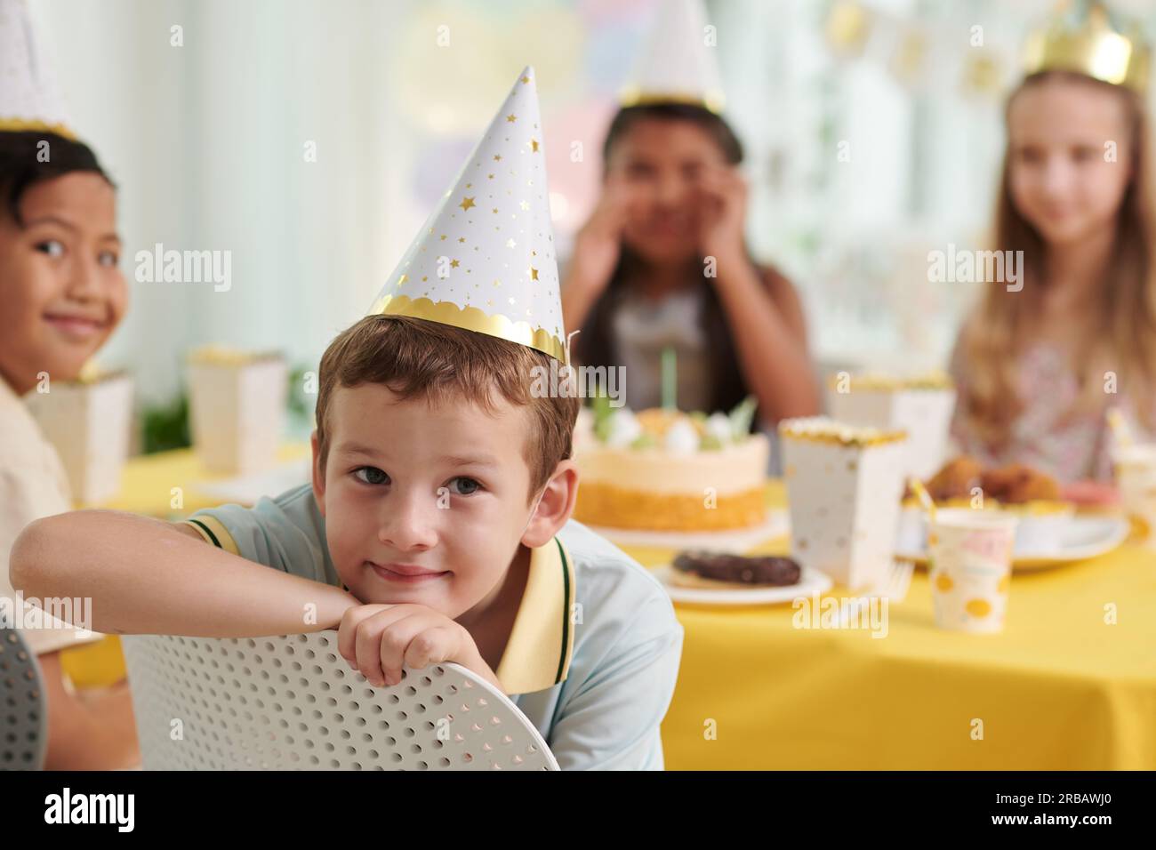 Portrait of smiling preteen boy attending birthday party Stock Photo ...