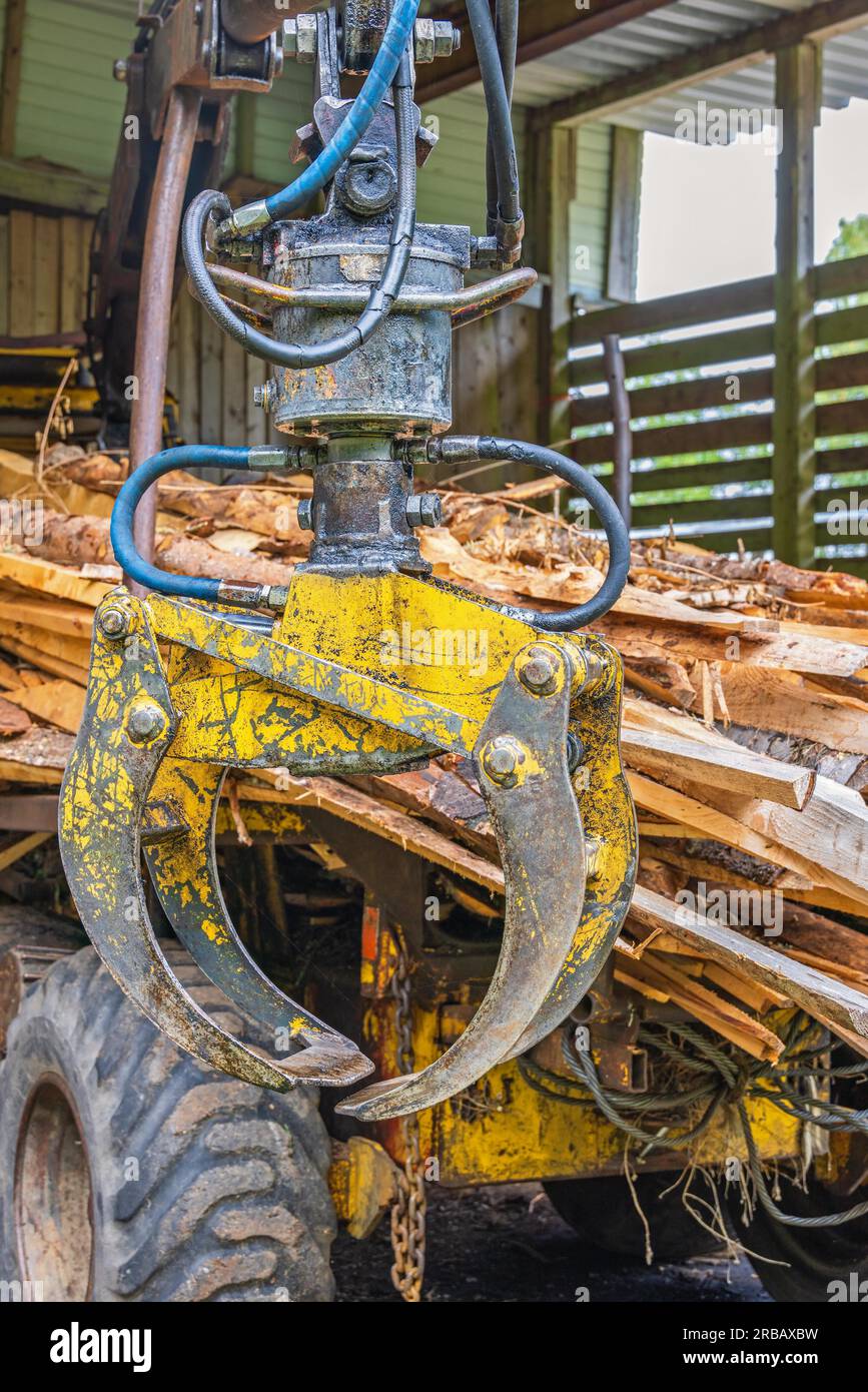 Forestry vehicle with a hydraulic Crane to lifting logs Stock Photo - Alamy