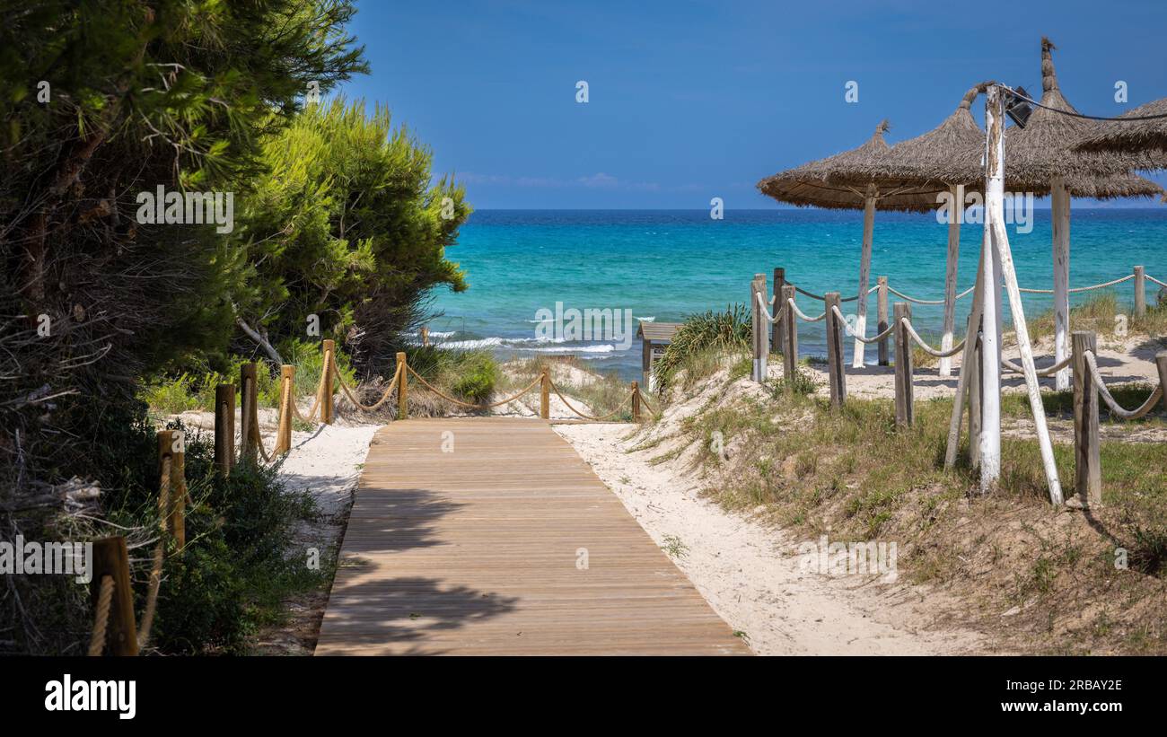 Wooden walkway to Playa de Muro beach, back Mediterranean Sea, Muro ...