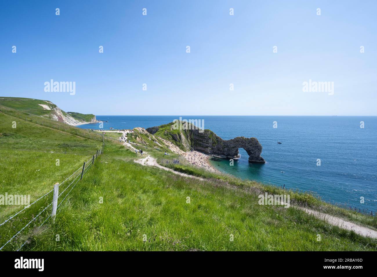 Walk along the chalk coast with the famous rock bridge Durdledoor, West ...