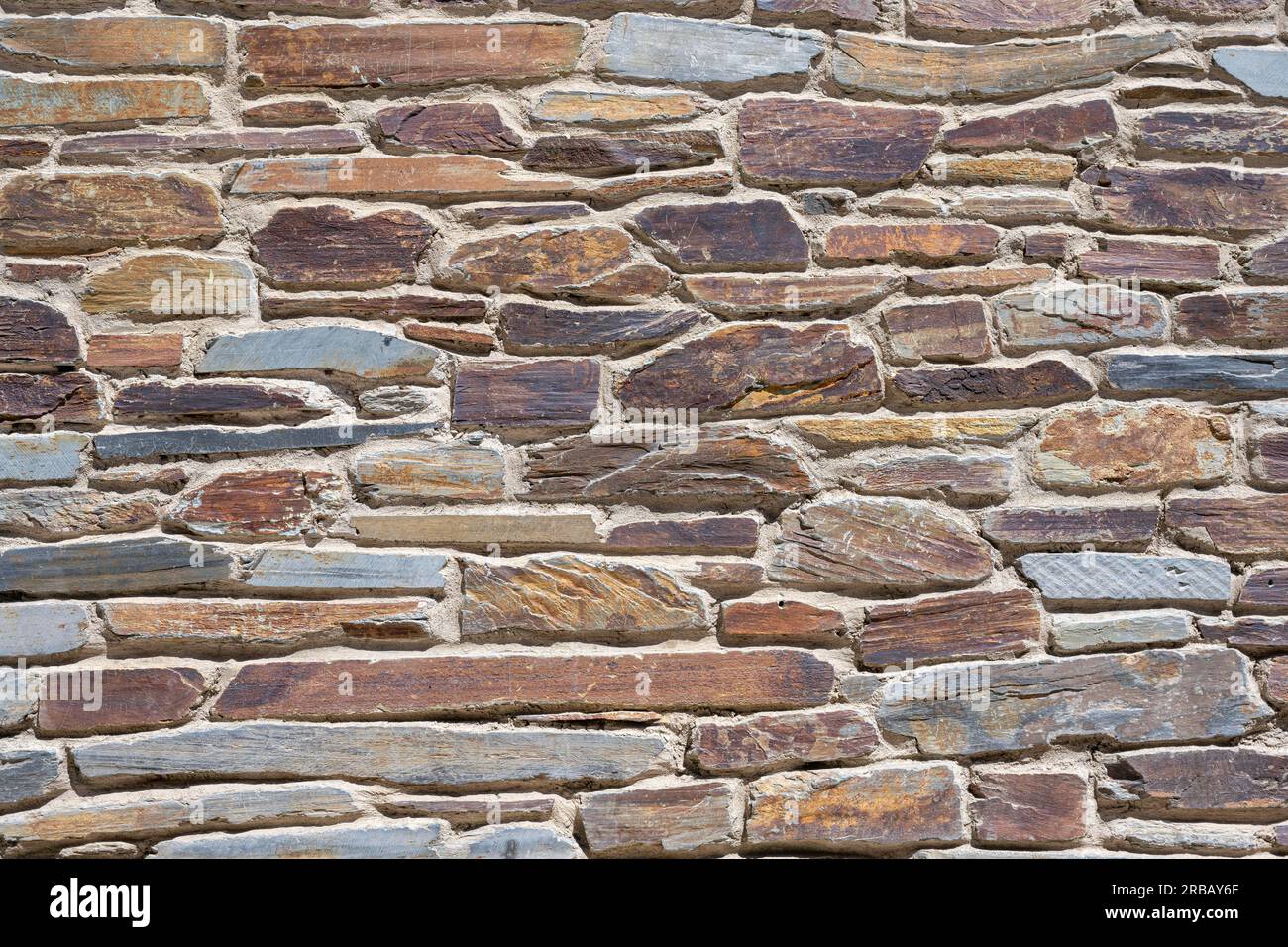 Slate slabs stacked to form a house wall, full-size, Port Isaac, North ...