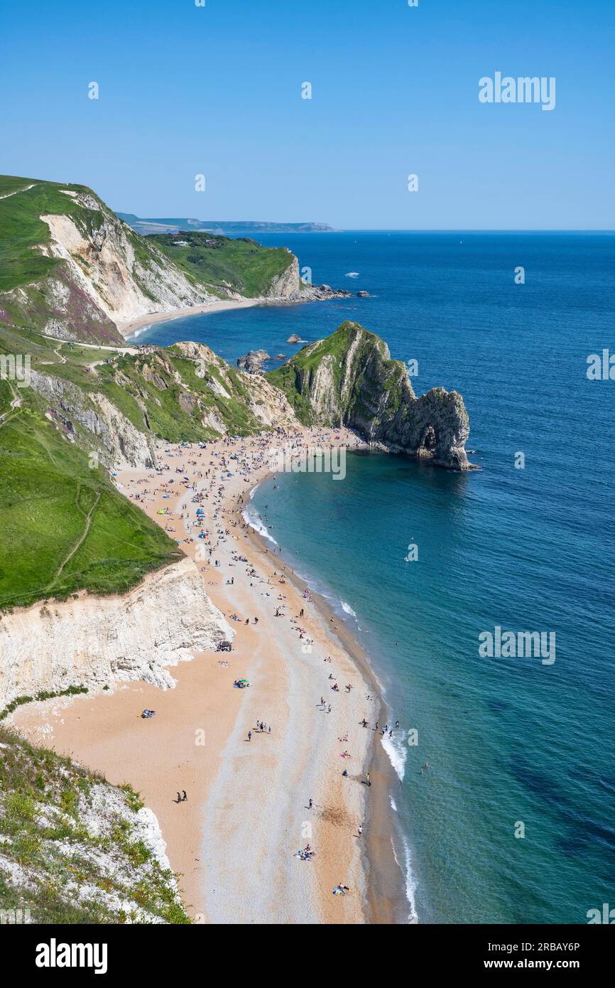 View over the chalk coast with the famous rock bridge Durdledoor, West ...
