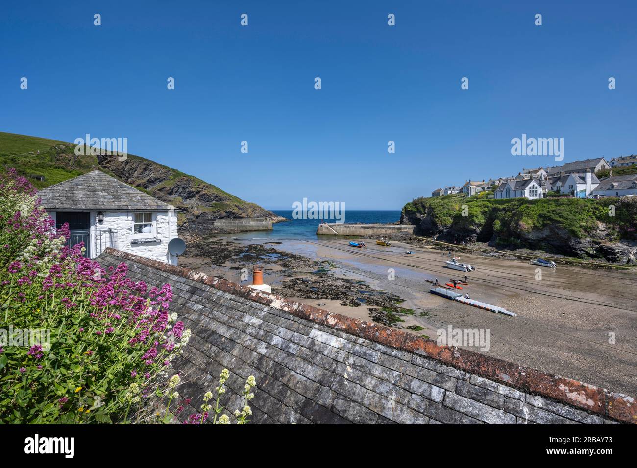 The slipway from the fishing harbour and the harbour entrance in Port ...