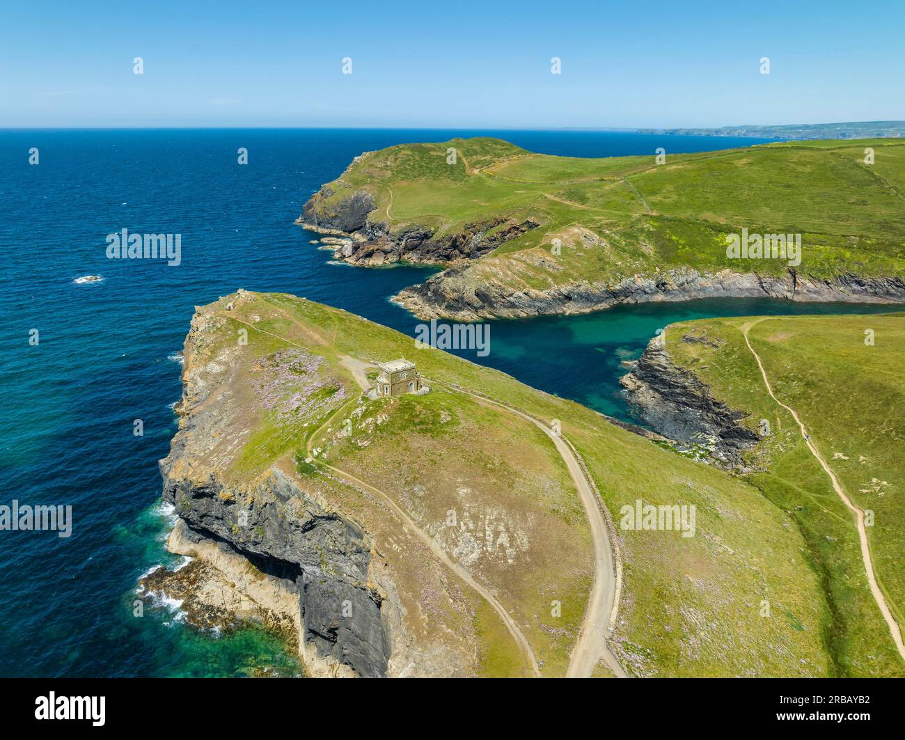 Aerial view of Port Quin with Doyden Castle, built around 1830, on a ...
