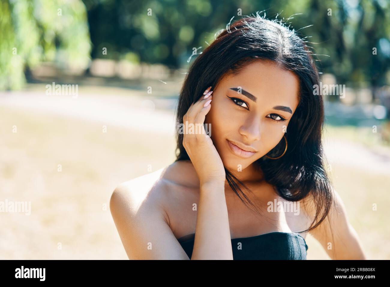 African beautiful woman portrait. Pretty young woman posing and looking ...