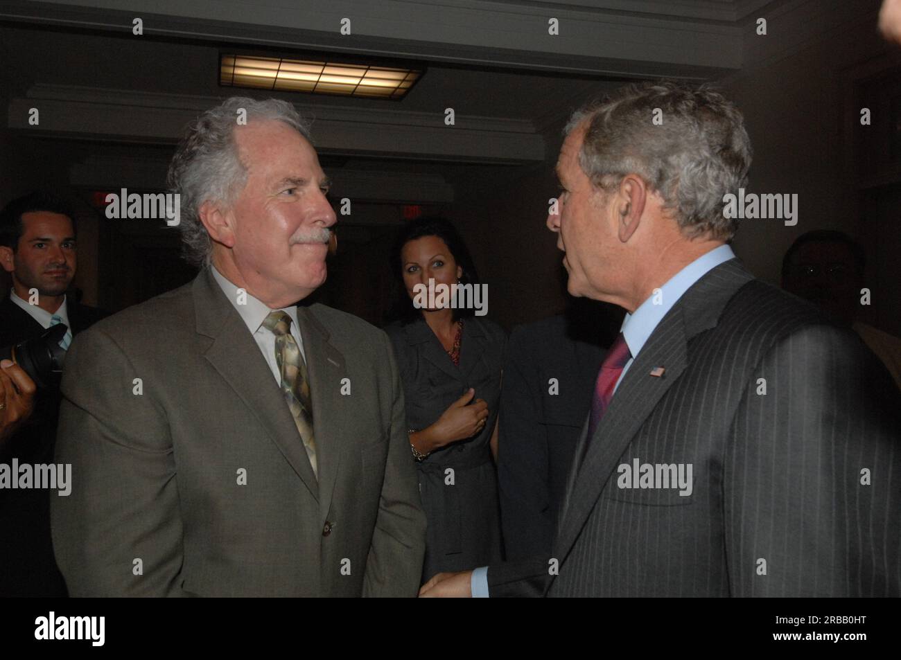 Department staff greeting President George W. Bush, from behind rope ...