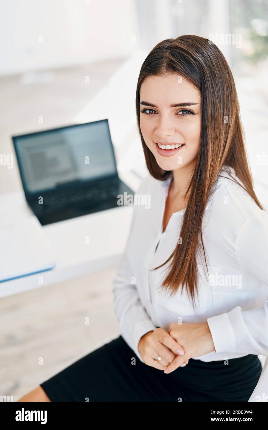 Smiling female employee in modern hi-res stock photography and images - Alamy