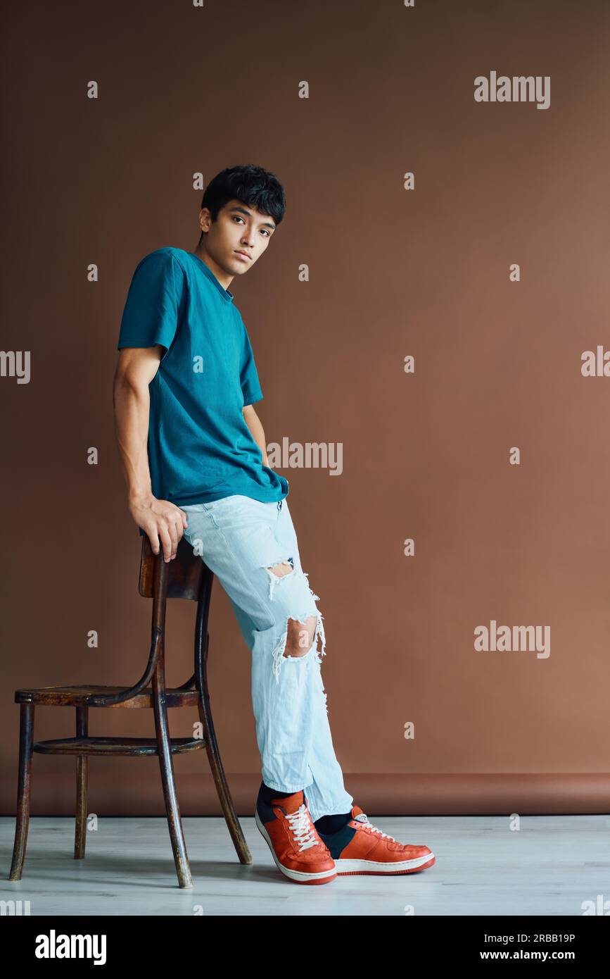 Stylish handsome young man full length portrait posing on studio ...