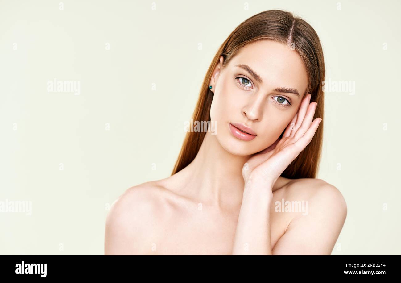 Close up portrait of beautiful young woman touching her face. Female ...