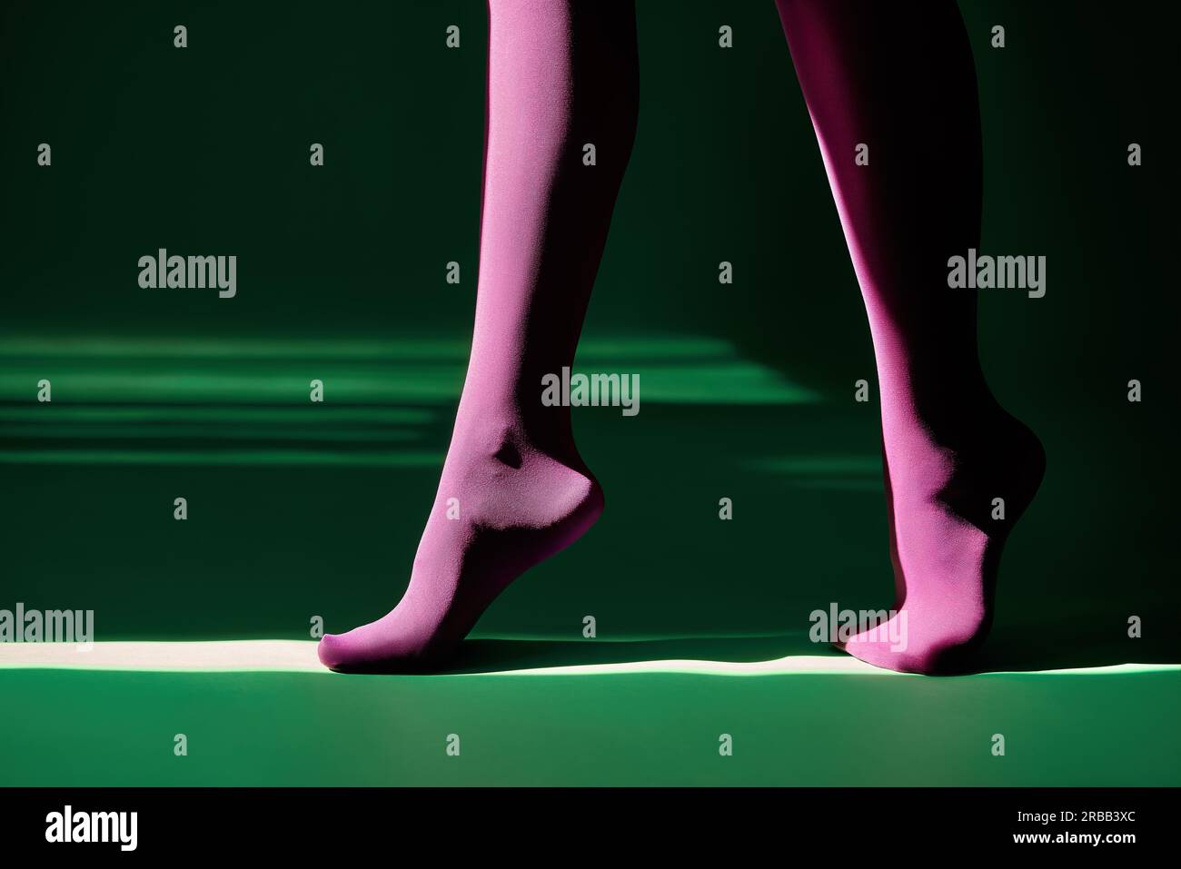 Close up profile view beautiful female feet in bright tights tiptoe on ...