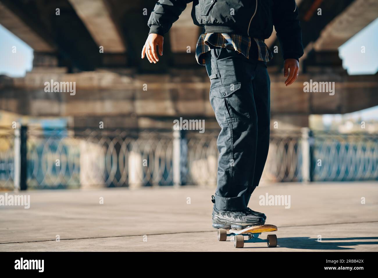 Skateboarder skateboarding on the street urban background. Extreme ...