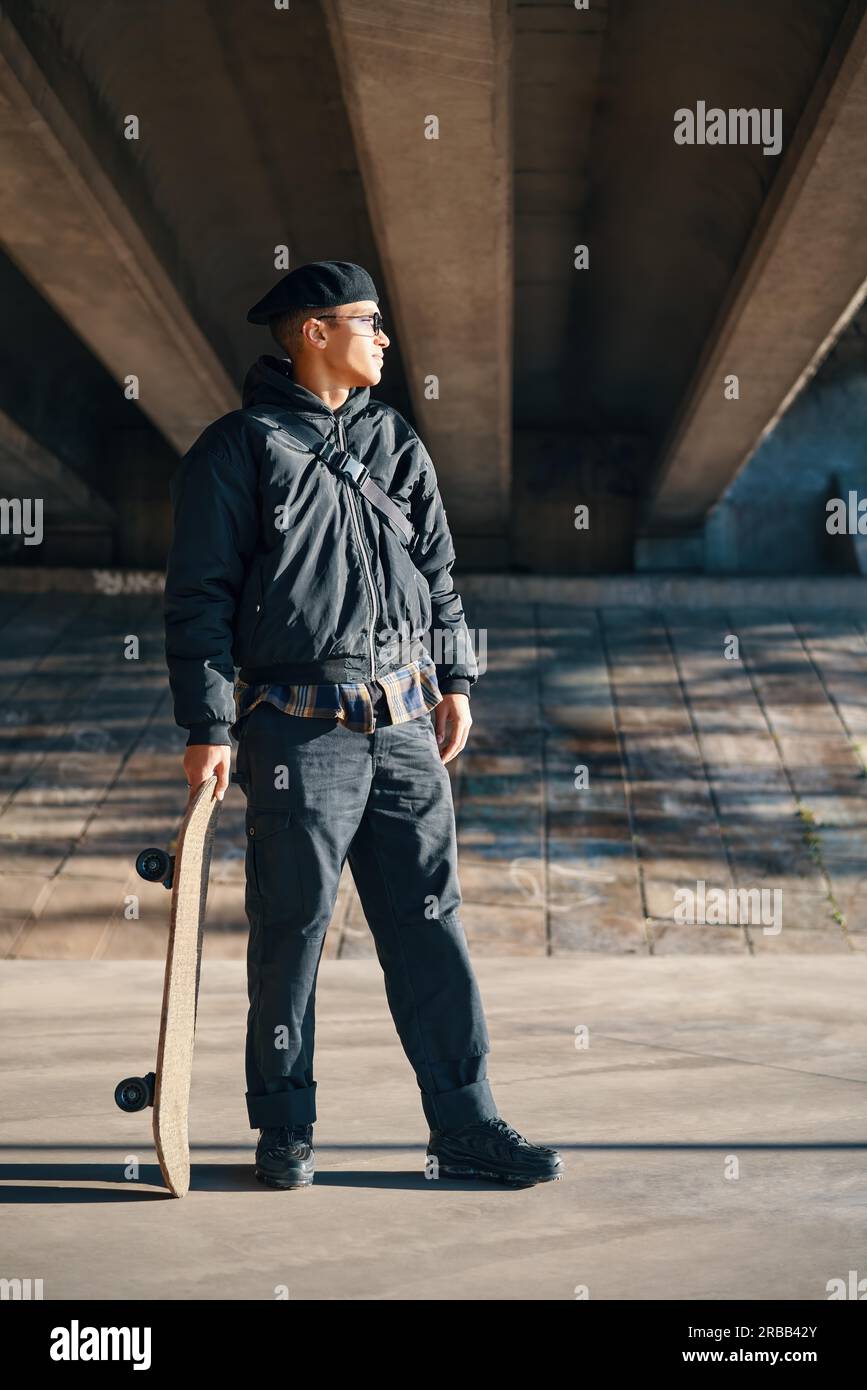 Skater male with skateboard on street urban background. Extreme sports ...
