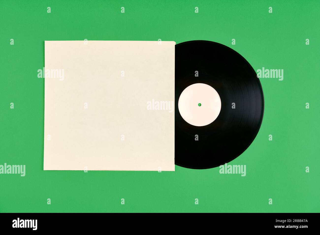 Vinyl record with cover mockup isolated over green background. Disco ...