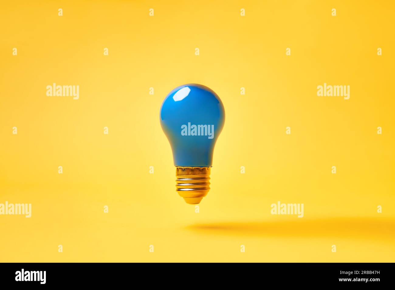 Blue lightbulb levitate on yellow background. Idea, inspiration ...