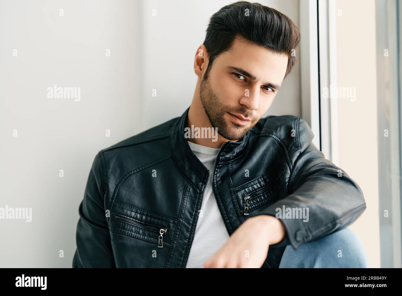 Closeup portrait of handsome trendy man posing on white studio ...