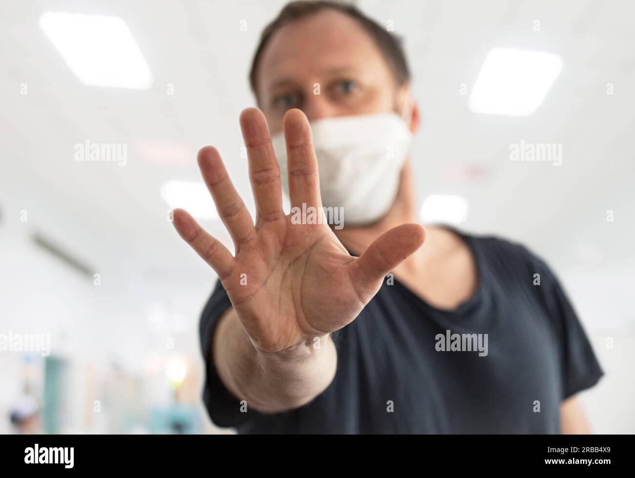 Man with mouth guard, fear of infection Stock Photo - Alamy