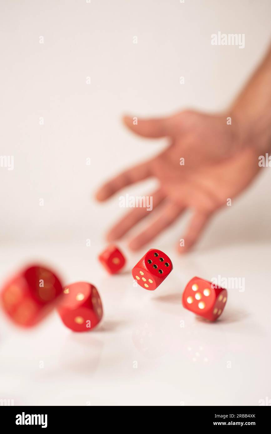 Red Rolling Dices Stock Photo - Alamy