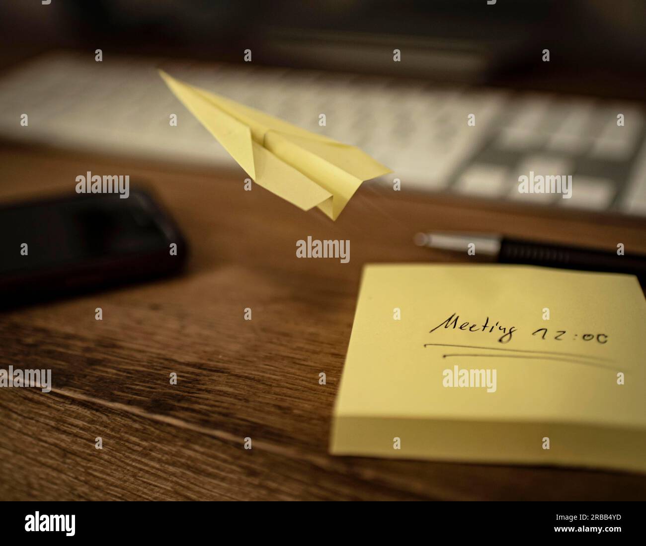 Paper Plane starts from office desk Stock Photo - Alamy