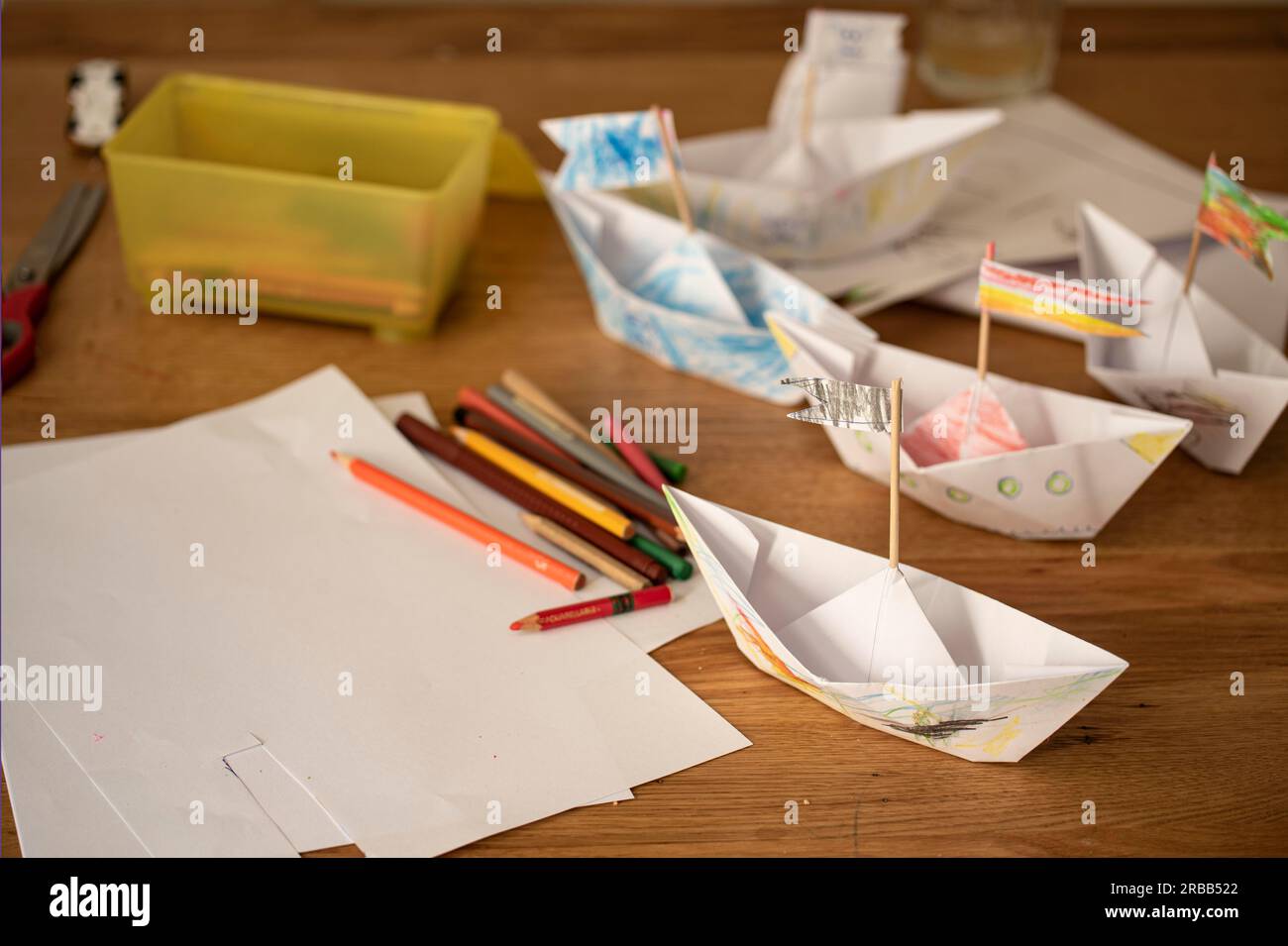 Paper ships made and painted by children Stock Photo - Alamy