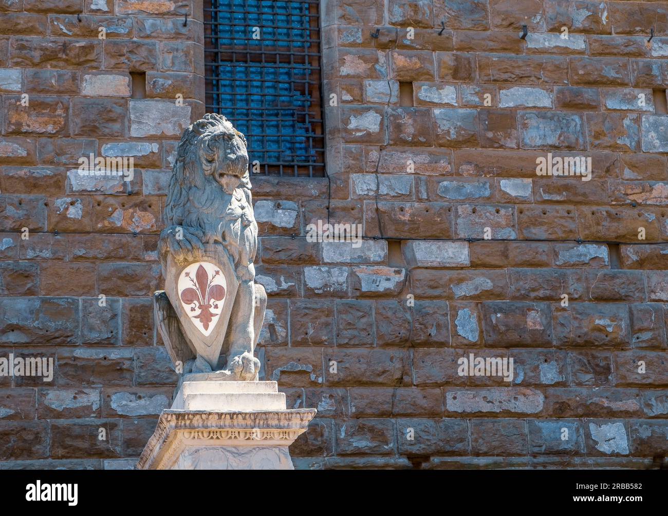 Ancient statue of a lion in Piazza della Signoria with the heraldic ...