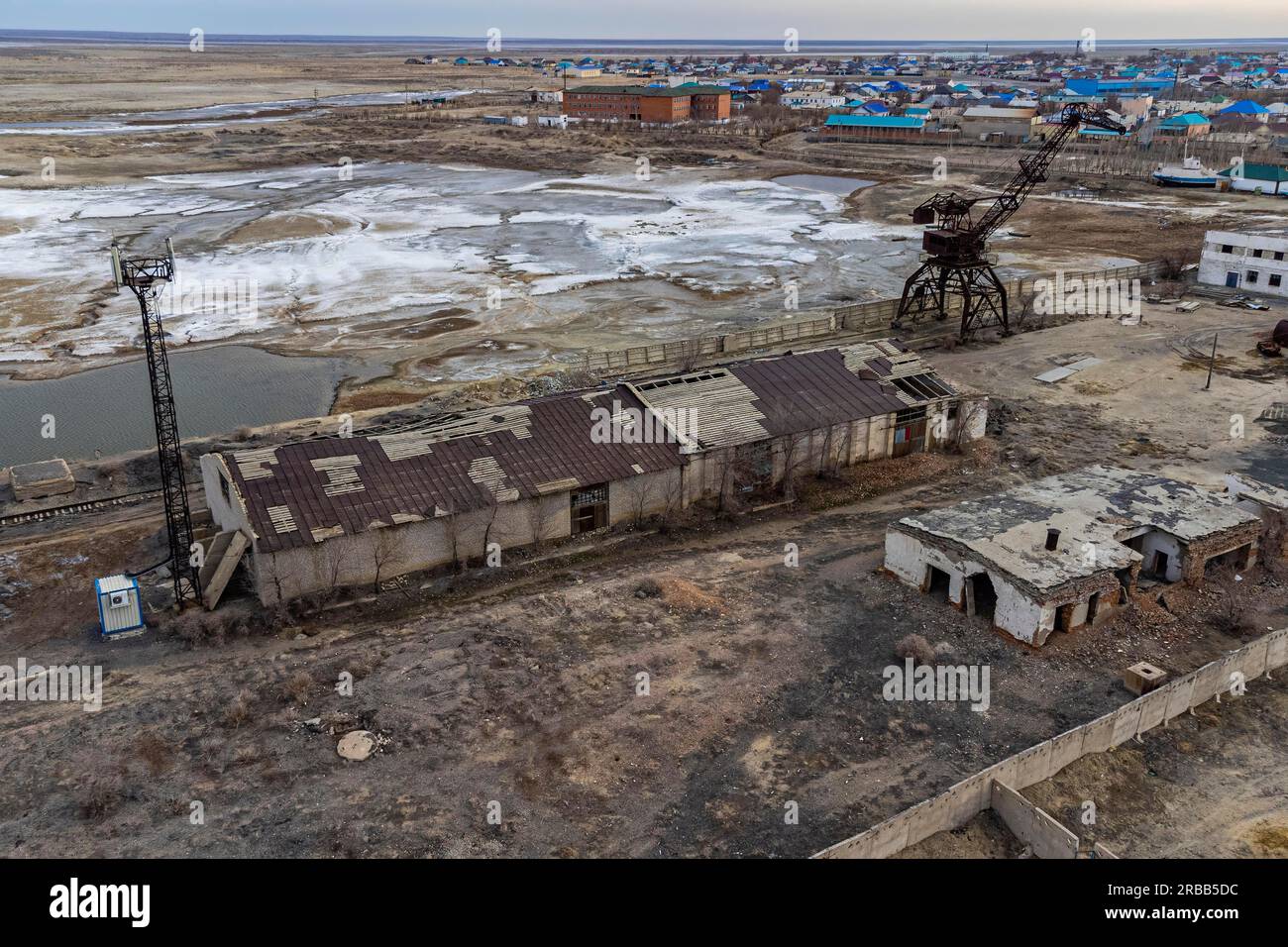 Aerial of the Aral lake and Aralsk, with its rusty cranes, Aral lake ...