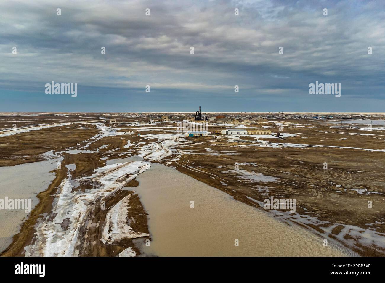Aerial of an old wheat farm in the semi frozen earth, South of Kostanay ...