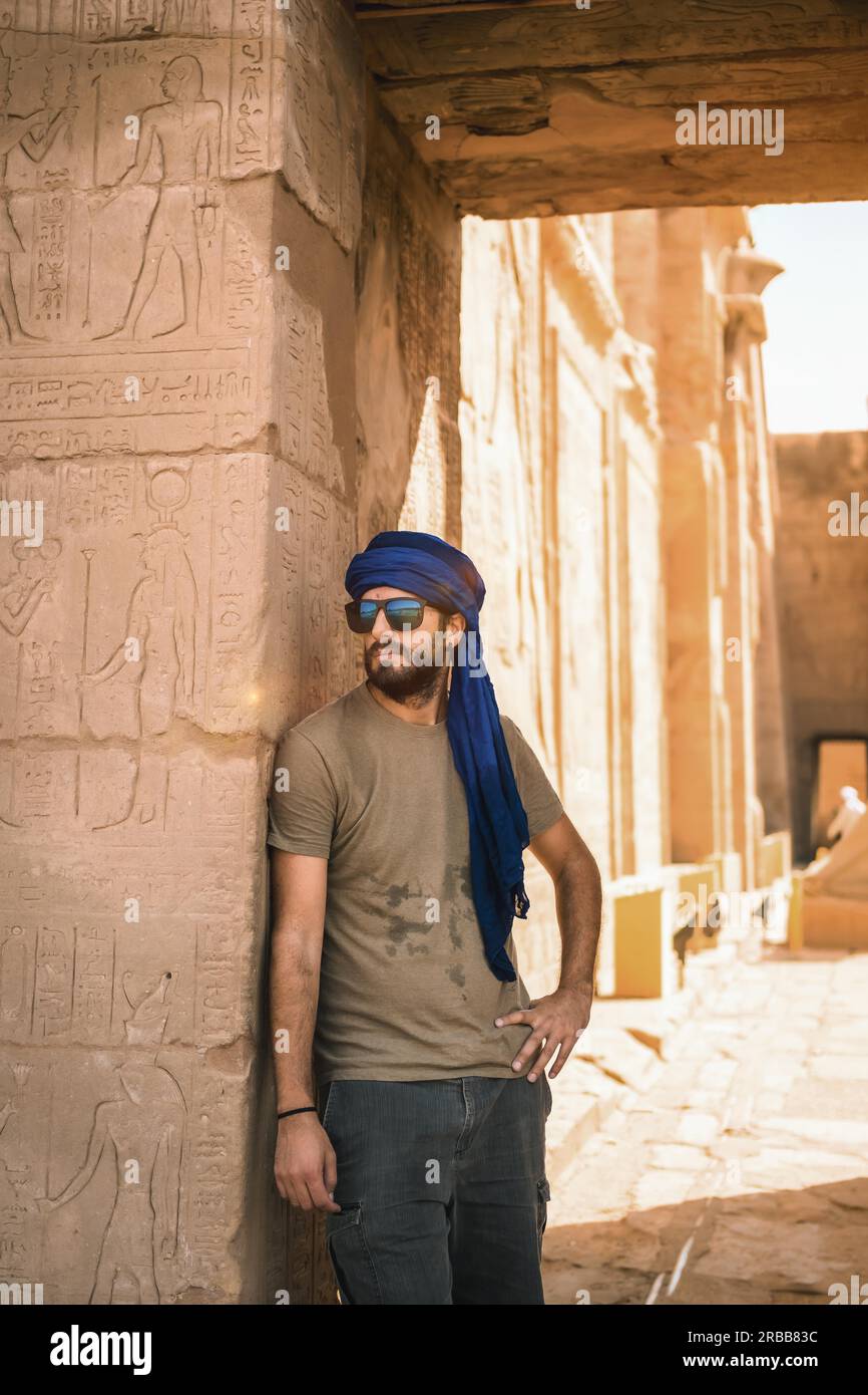 Portrait of a young man with a blue turban at the entrance to the Edfu ...