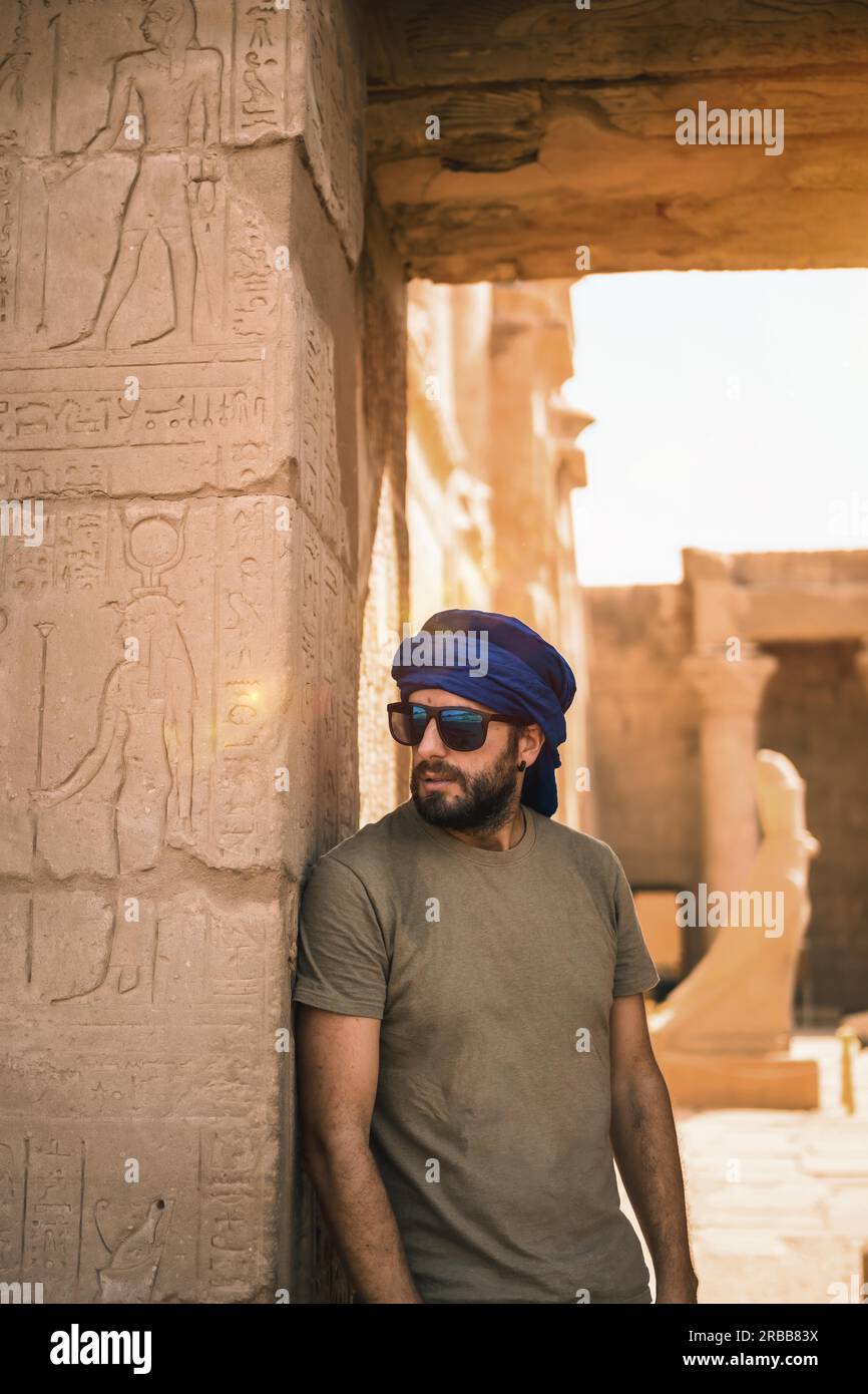 Portrait of a young man with a blue turban at the entrance to the Edfu ...