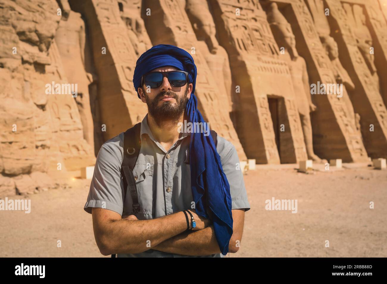 A young man wearing a blue turban visiting the Egyptian Temple of ...
