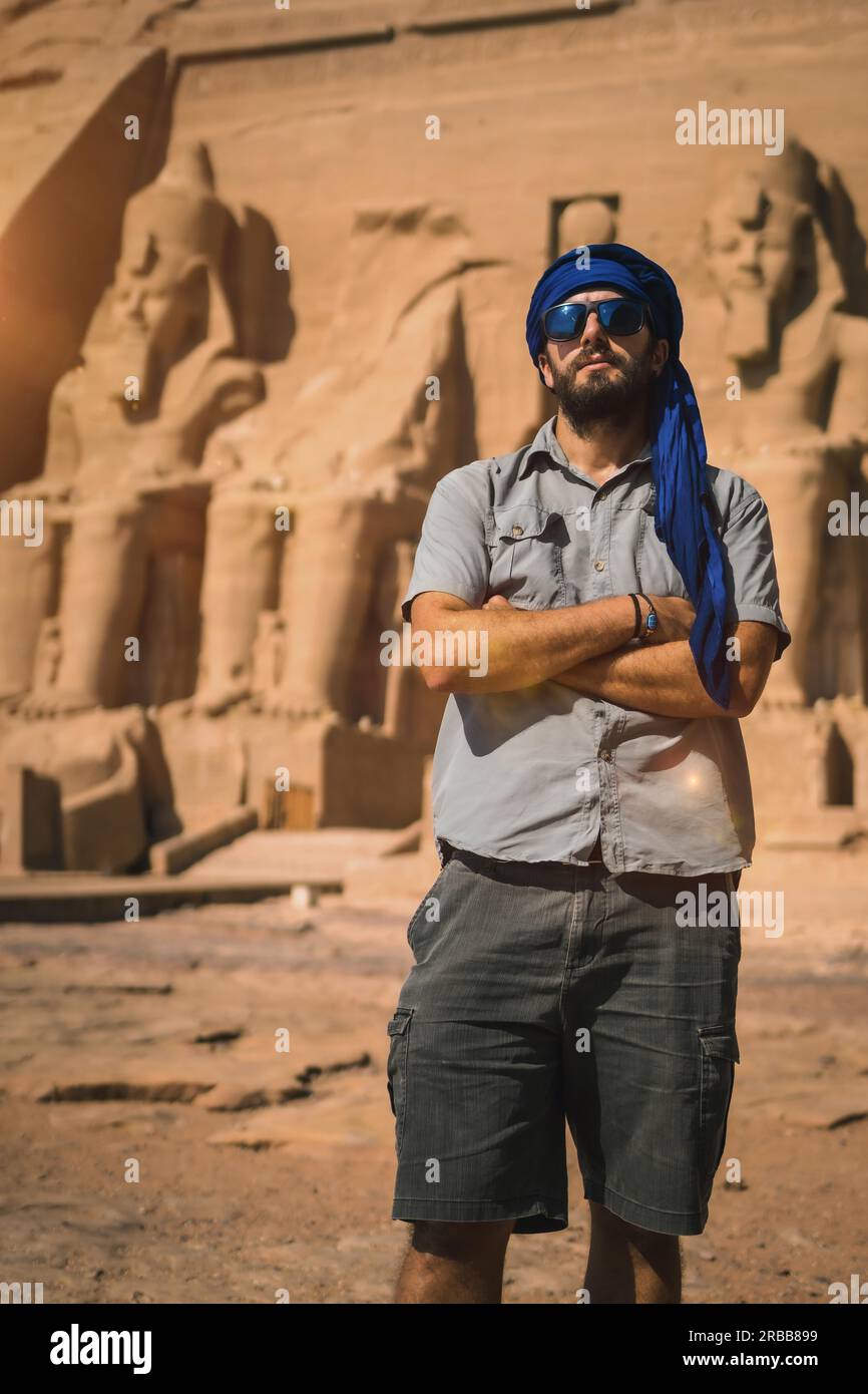 A young tourist with a blue turban visiting the Abu Simbel Temple in ...