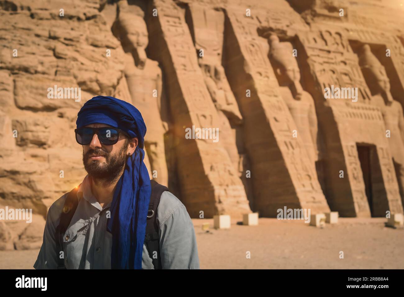 A young man wearing a blue turban visiting the Egyptian Temple of ...