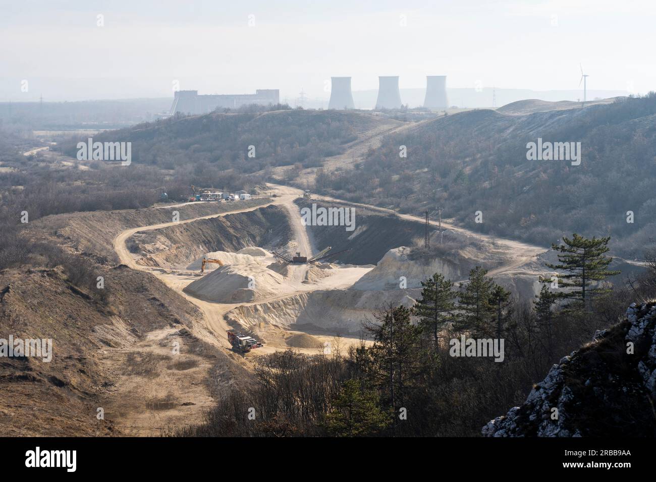 Stone mine with machinery in the background old thermal power plant and ...
