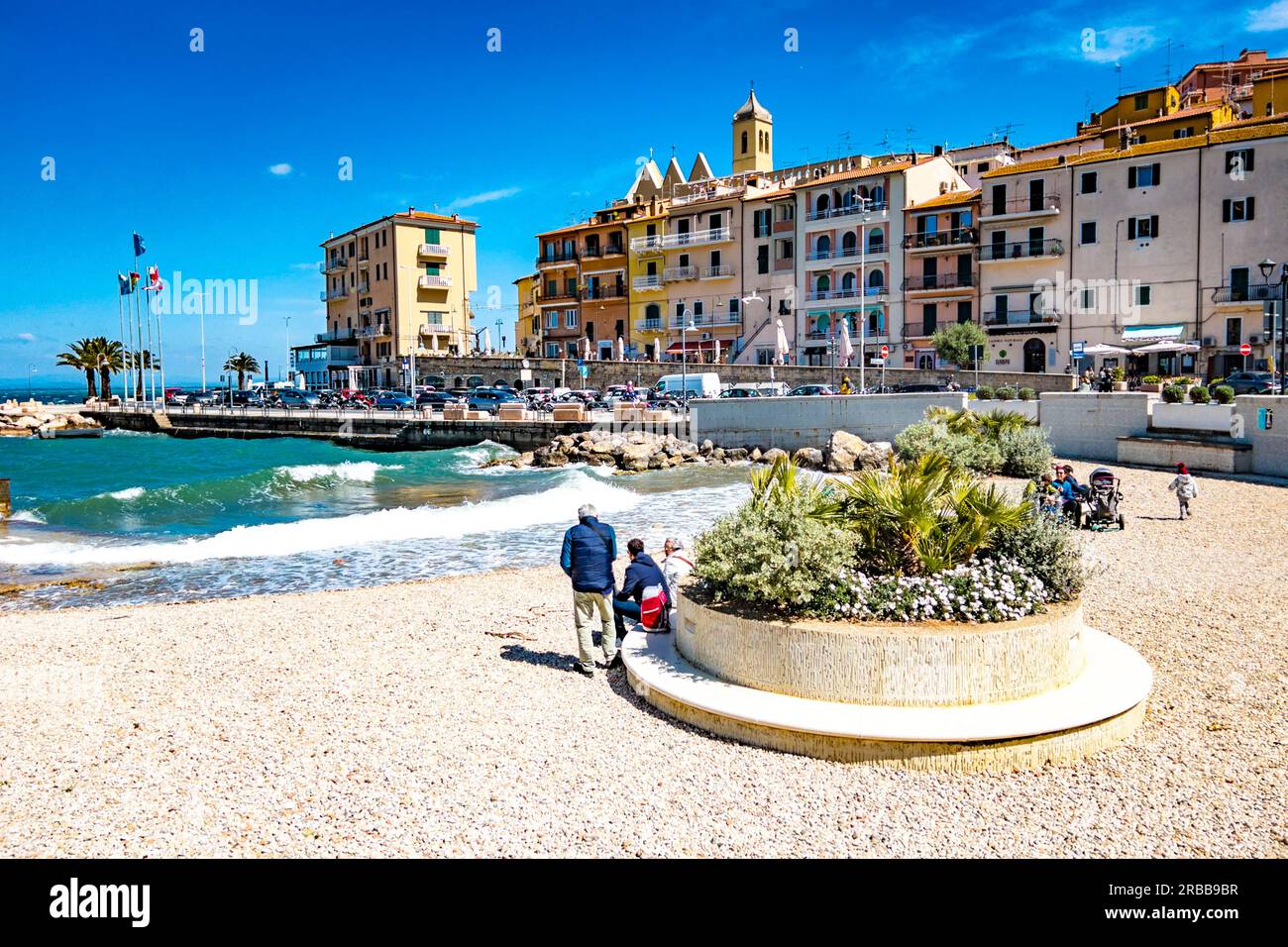 Artificial pebble beach in the old harbour of Porto Santo Stefano ...