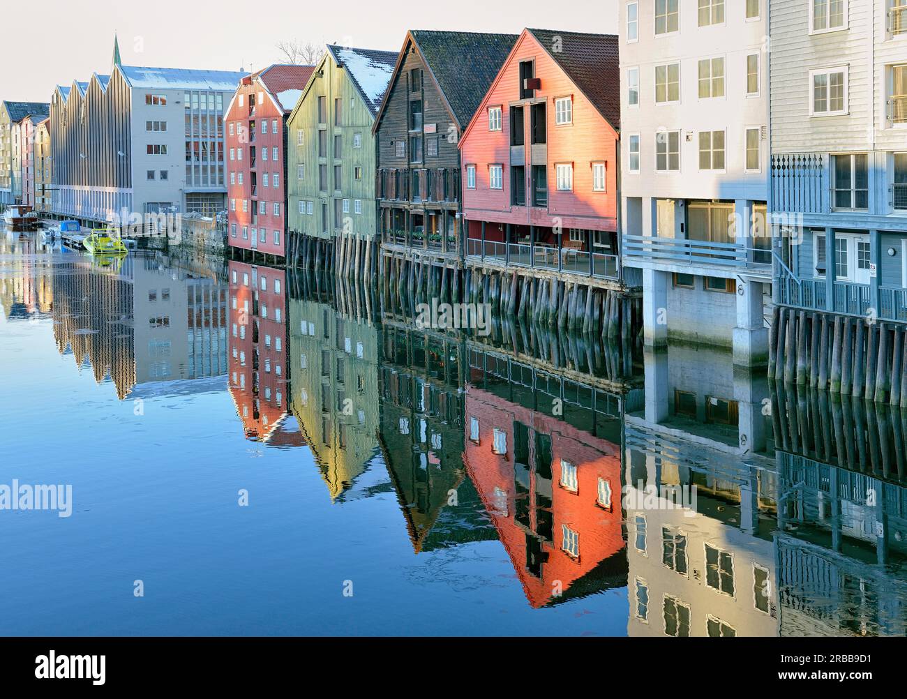 Historic wooden warehouses between modern new buildings, Trondheim ...