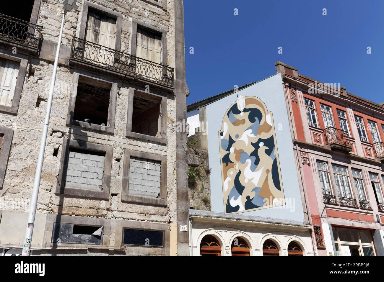 Mural with geometric shapes between houses in the historic old town ...