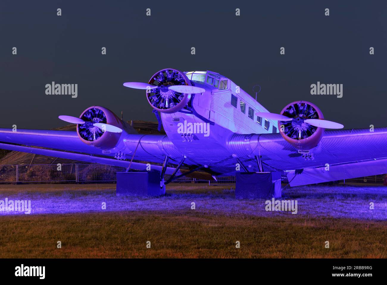 Restored Junkers JU 52, historic propeller plane, illuminated at the ...