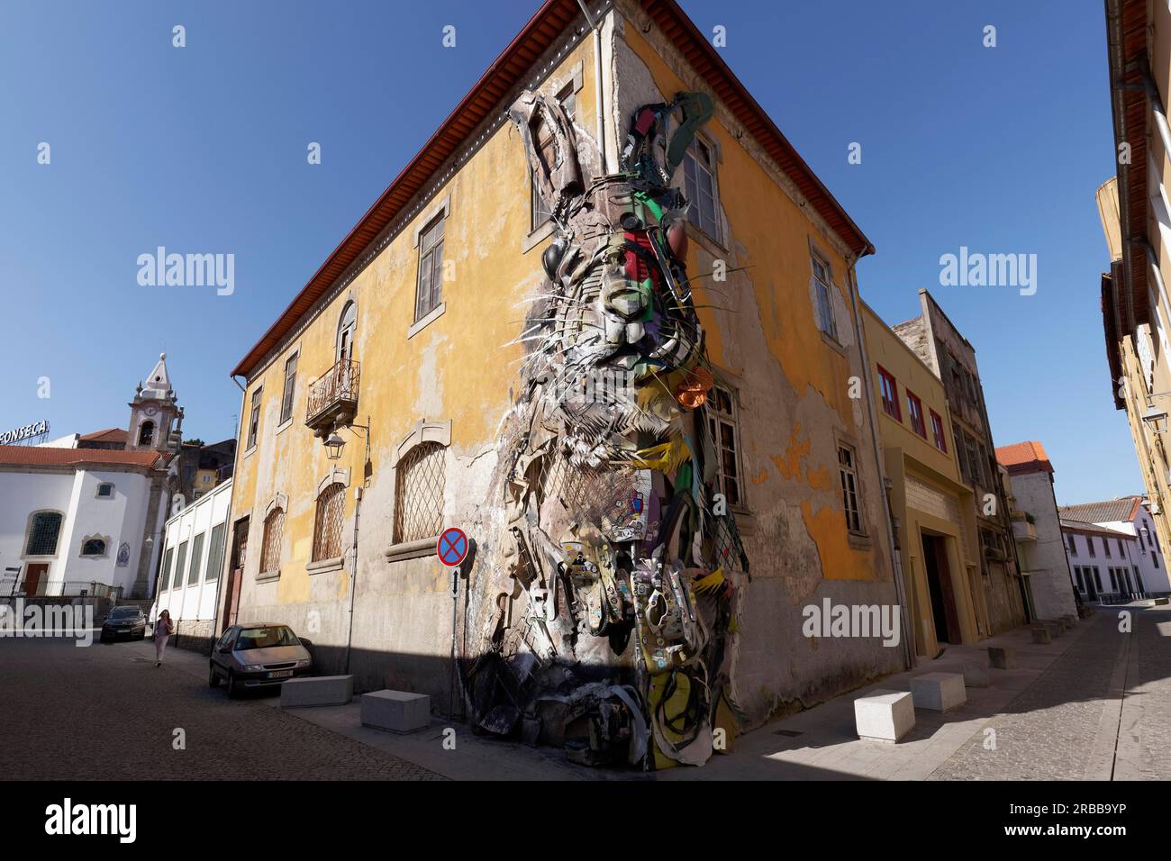 Half Rabbit, figure of a rabbit made of scrap and rubbish on the corner ...