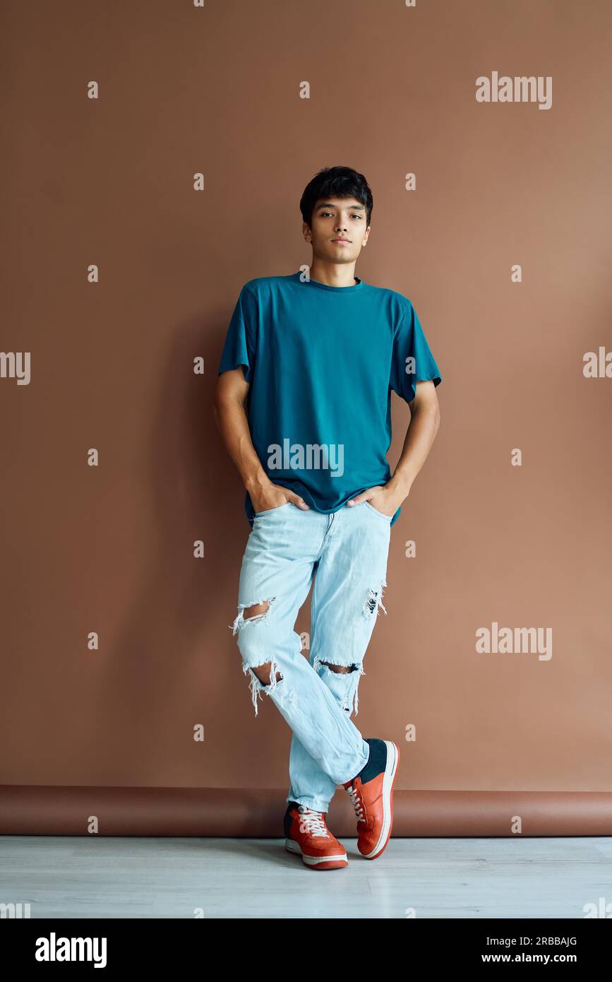 Stylish handsome young man full length portrait posing on studio ...
