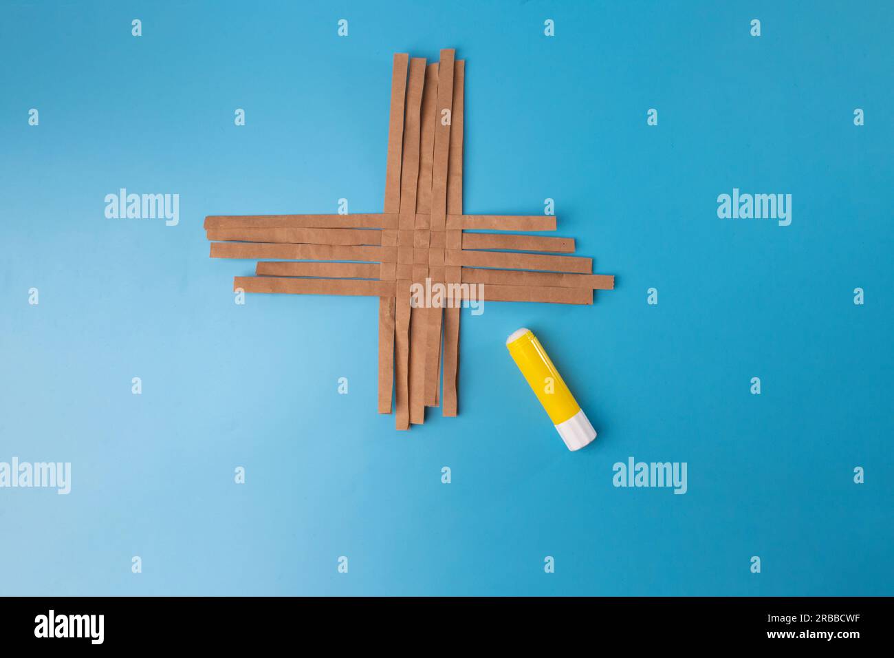 paper strip interlacing and glue stick top view Stock Photo - Alamy